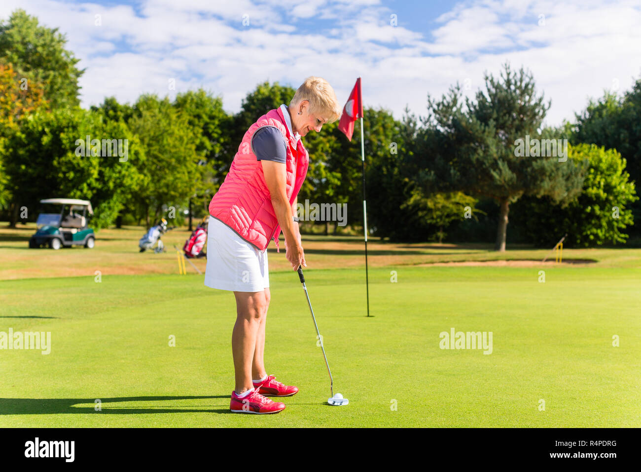 Older Woman Playing Golf High Resolution Stock Photography and Images ...