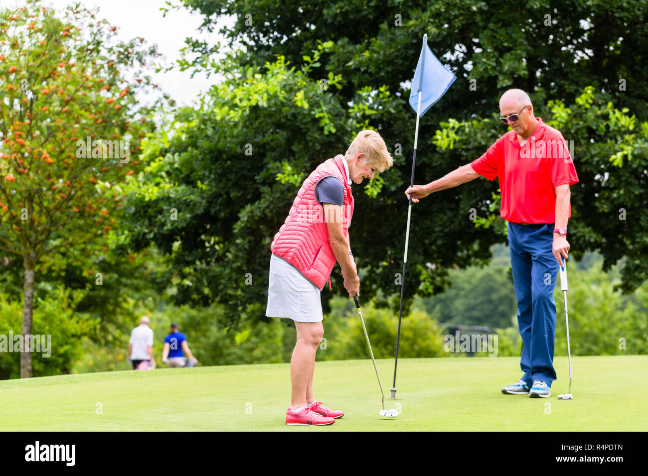 Older Woman Playing Golf High Resolution Stock Photography and Images ...