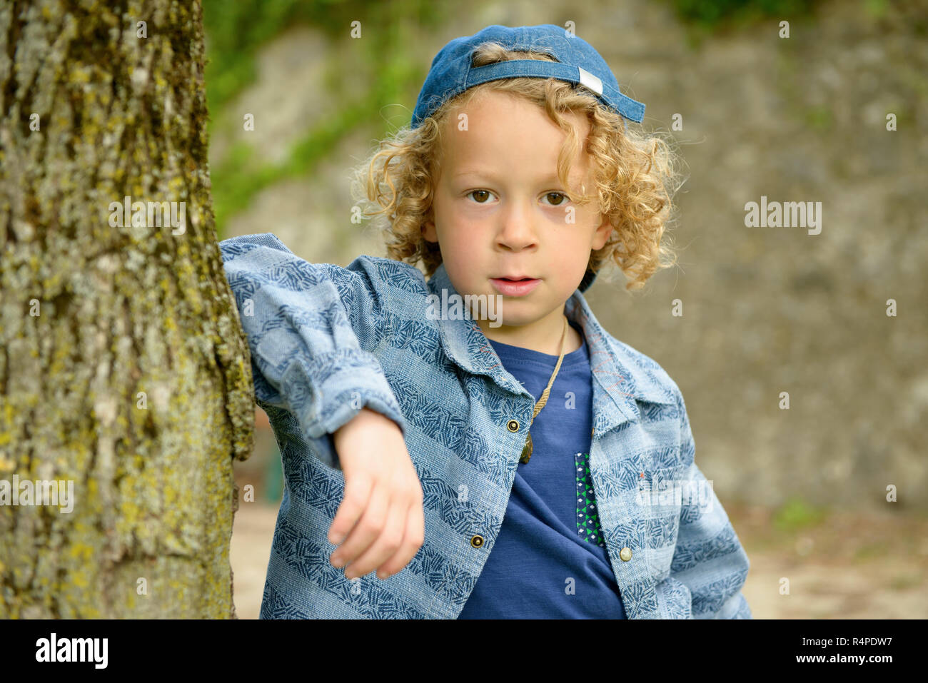 blond boy with a blue cap Stock Photo - Alamy