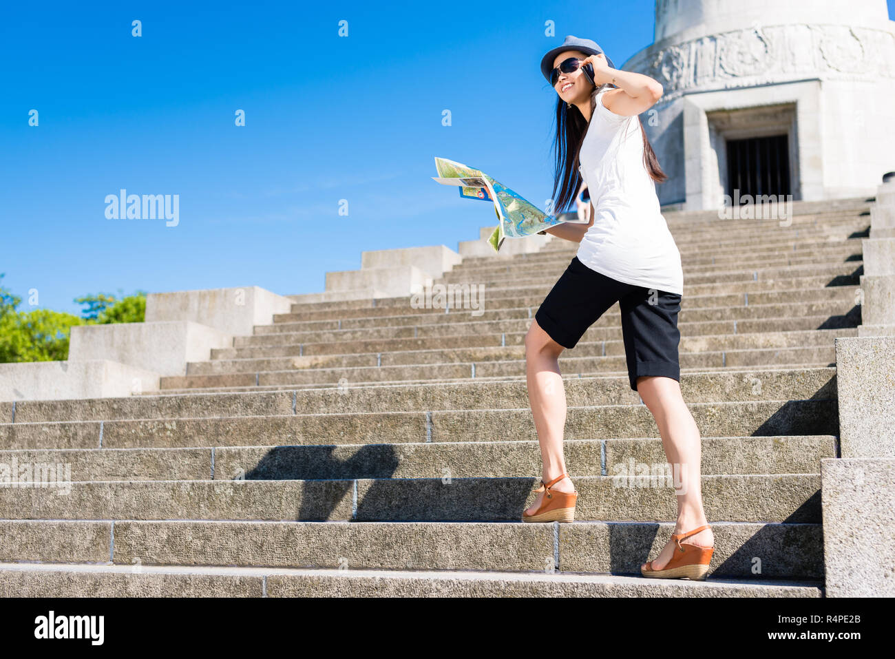 Happy young Asian tourist climbing stairs Stock Photo - Alamy