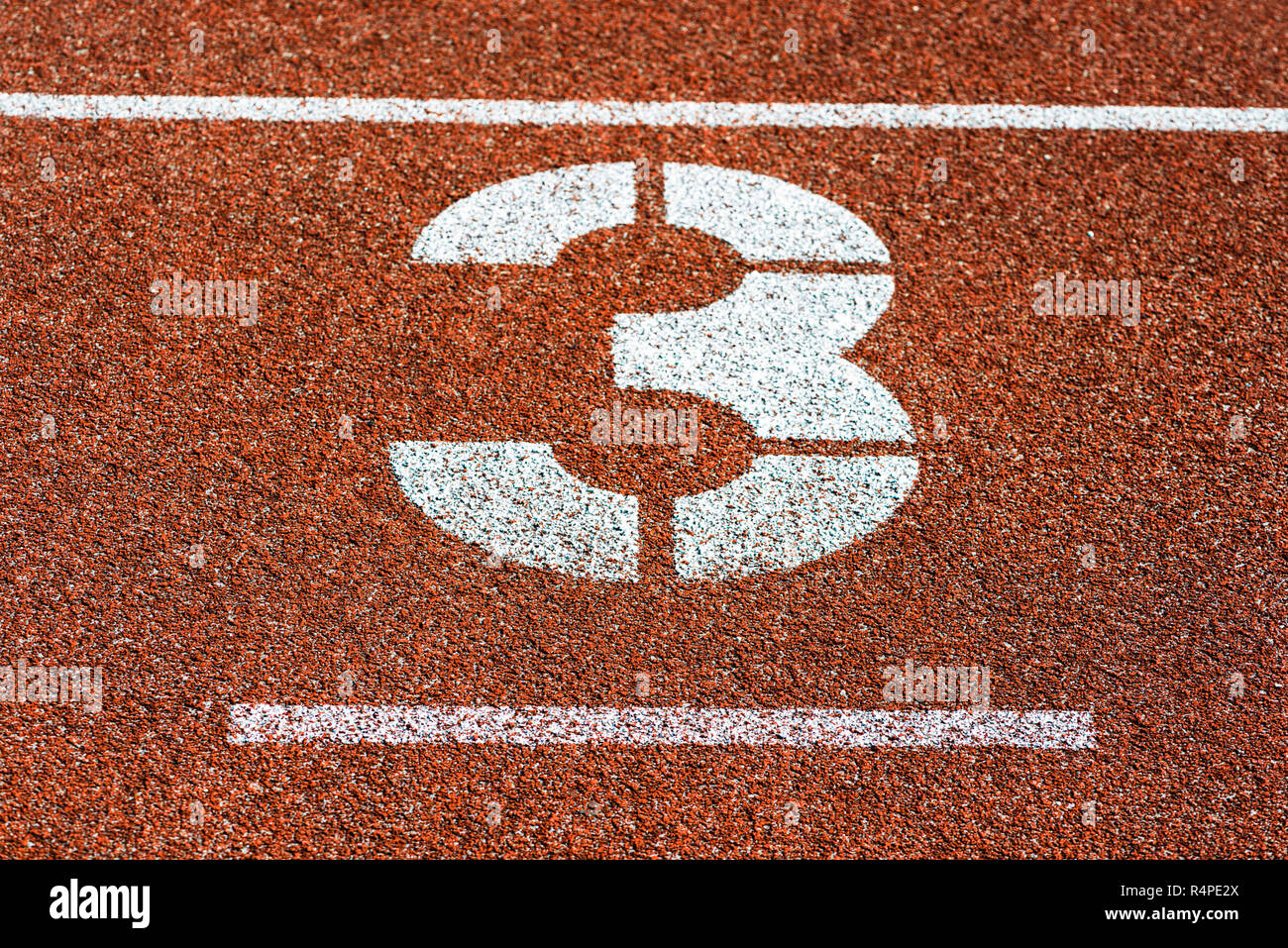 Start number three at cinder track of track and field running track ...