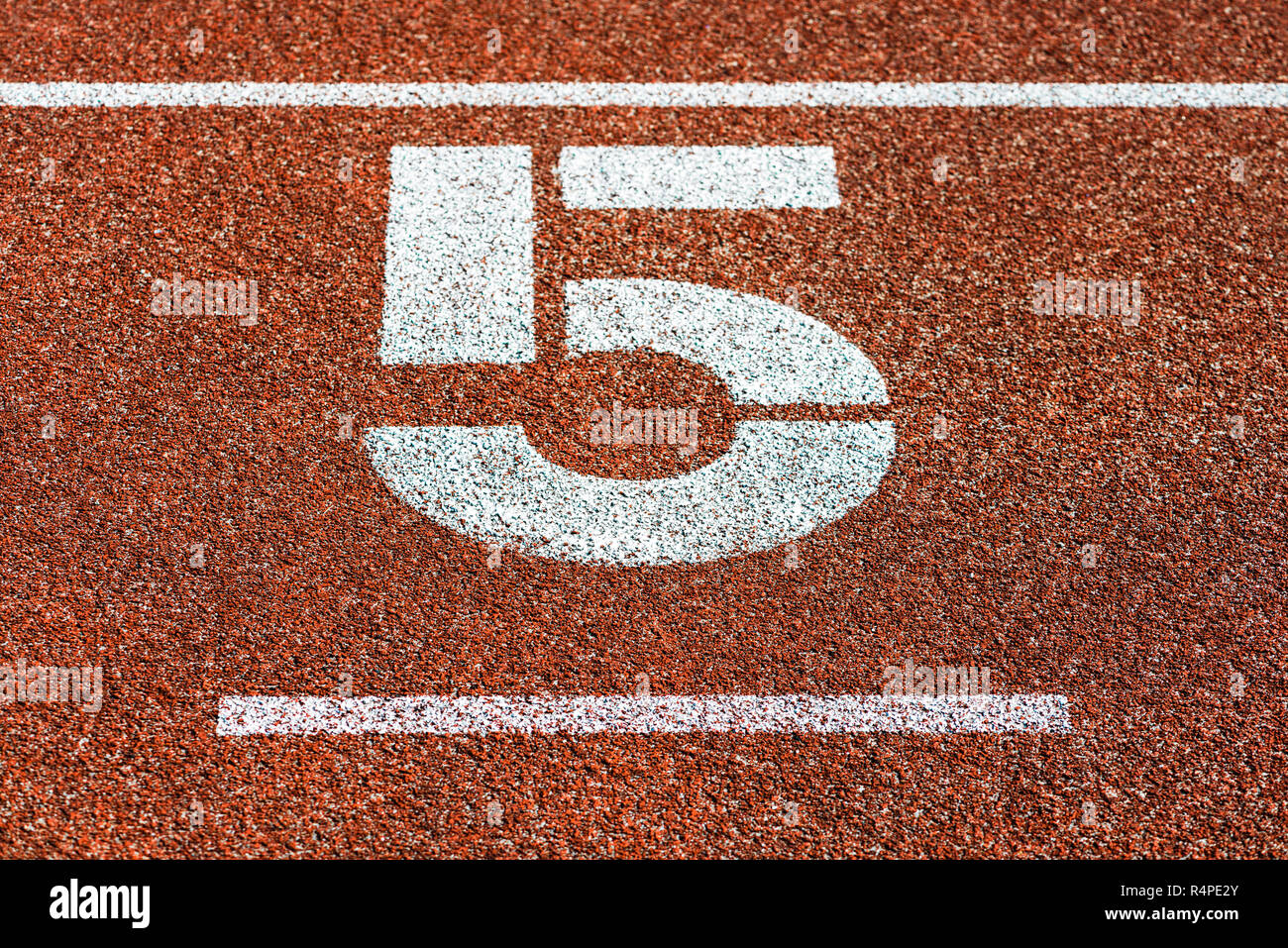 Start number five at cinder track of track and field running track ...