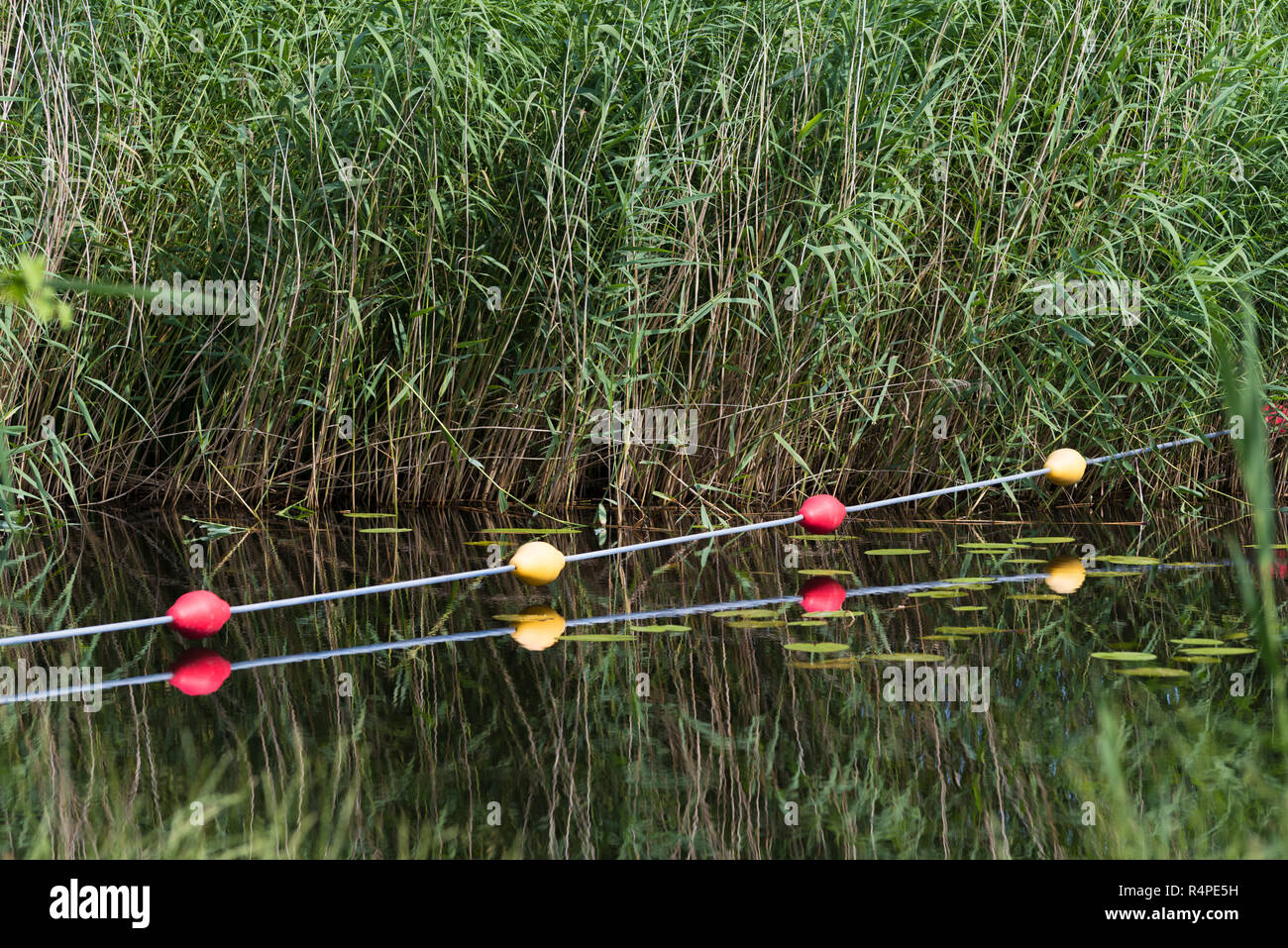 buoy line over canal Stock Photo - Alamy