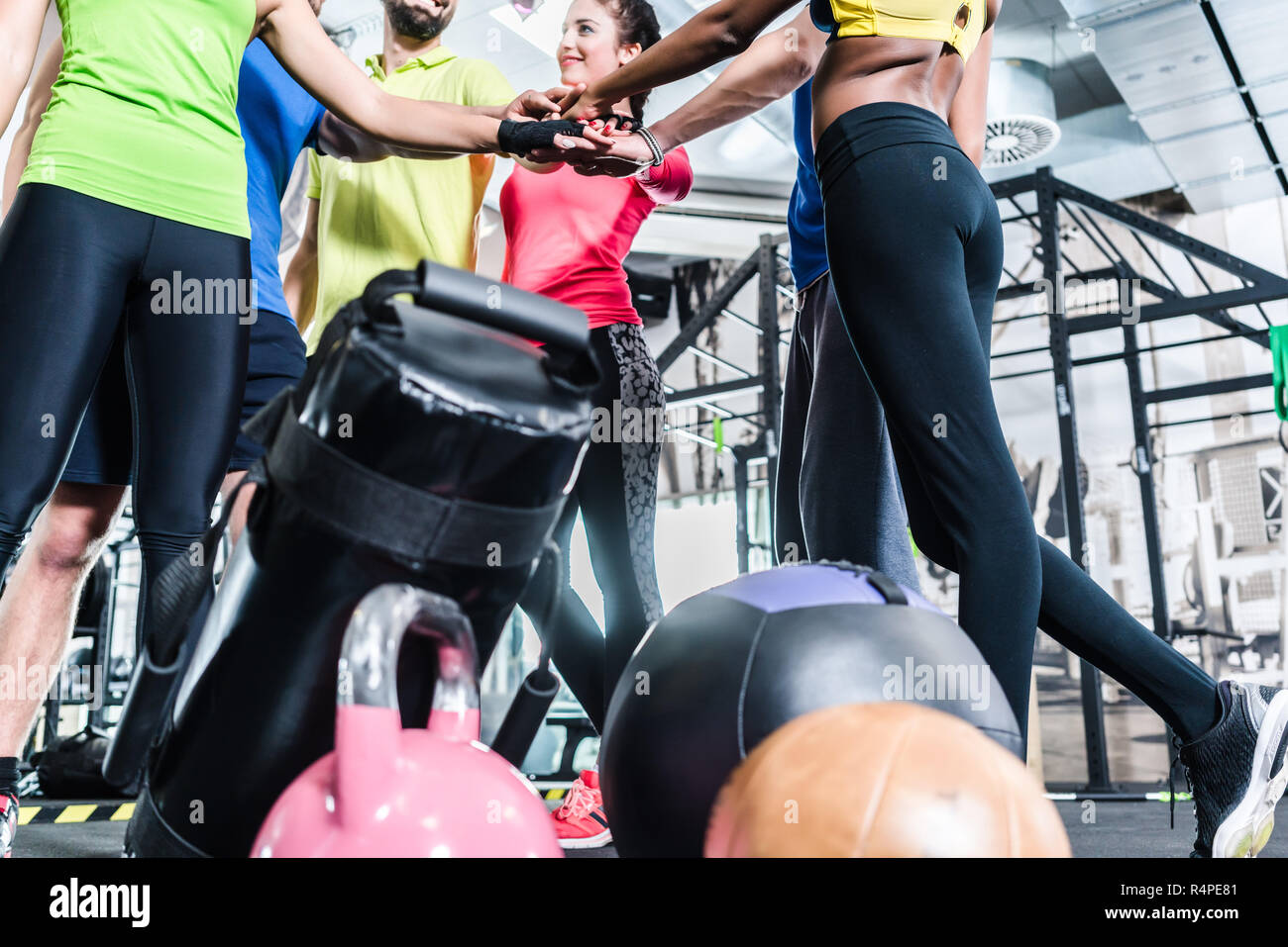 Woman and men being motivated for fitness and sport Stock Photo - Alamy