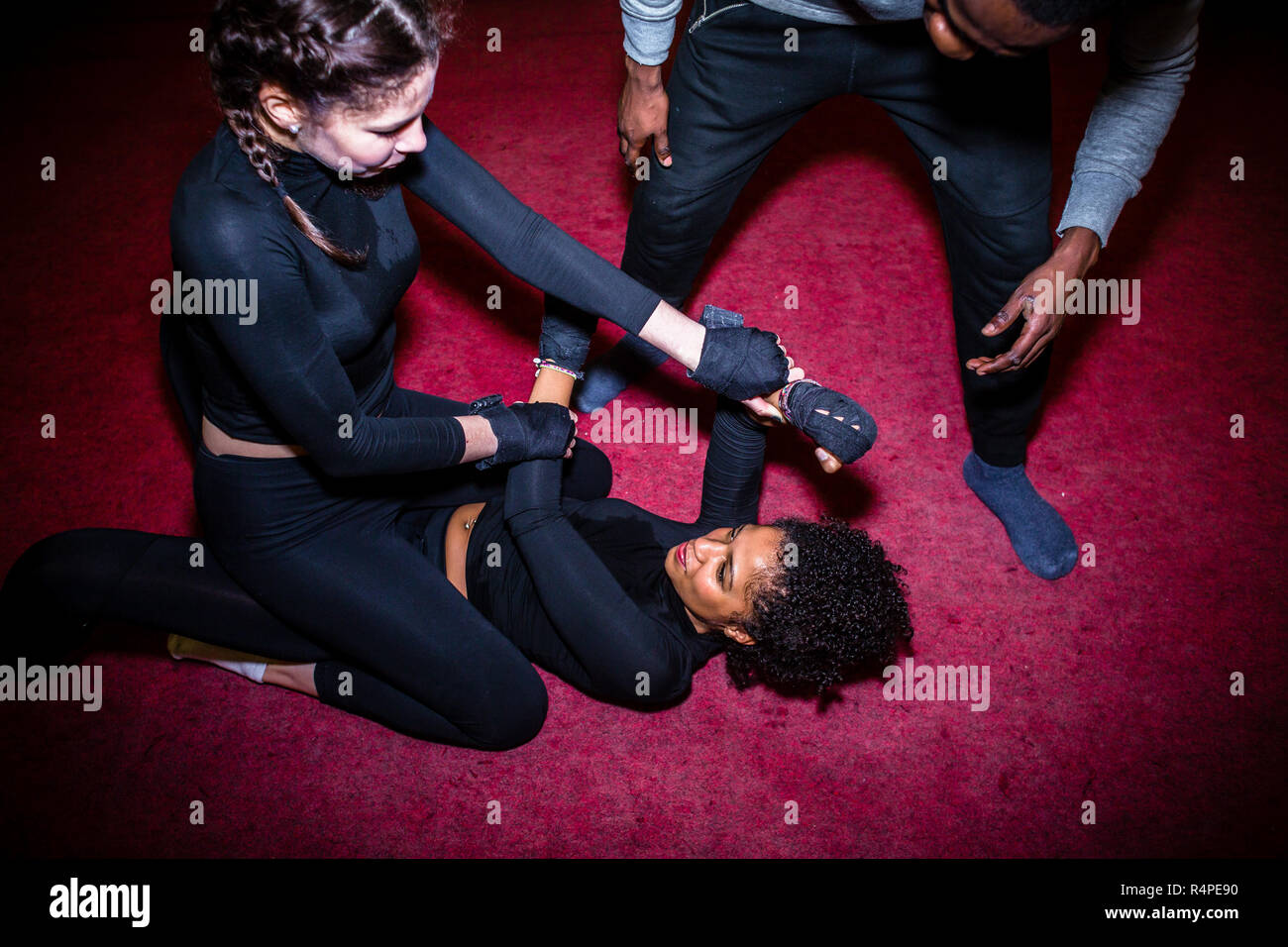 Female fighter dominating her opponent during MMA match Stock Photo - Alamy