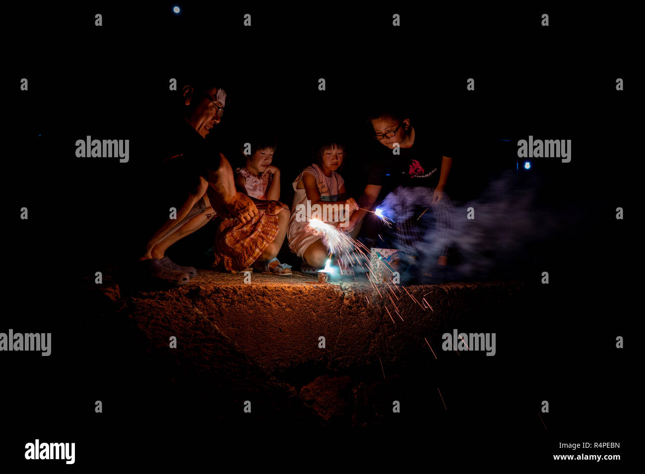 Kids Playing Fireworks Stock Photo - Alamy