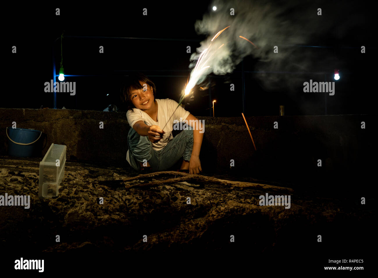 Kids Playing Fireworks Stock Photo - Alamy