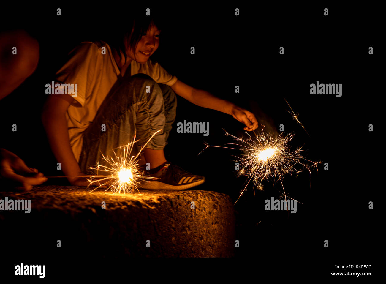 Kids Playing Fireworks Stock Photo - Alamy