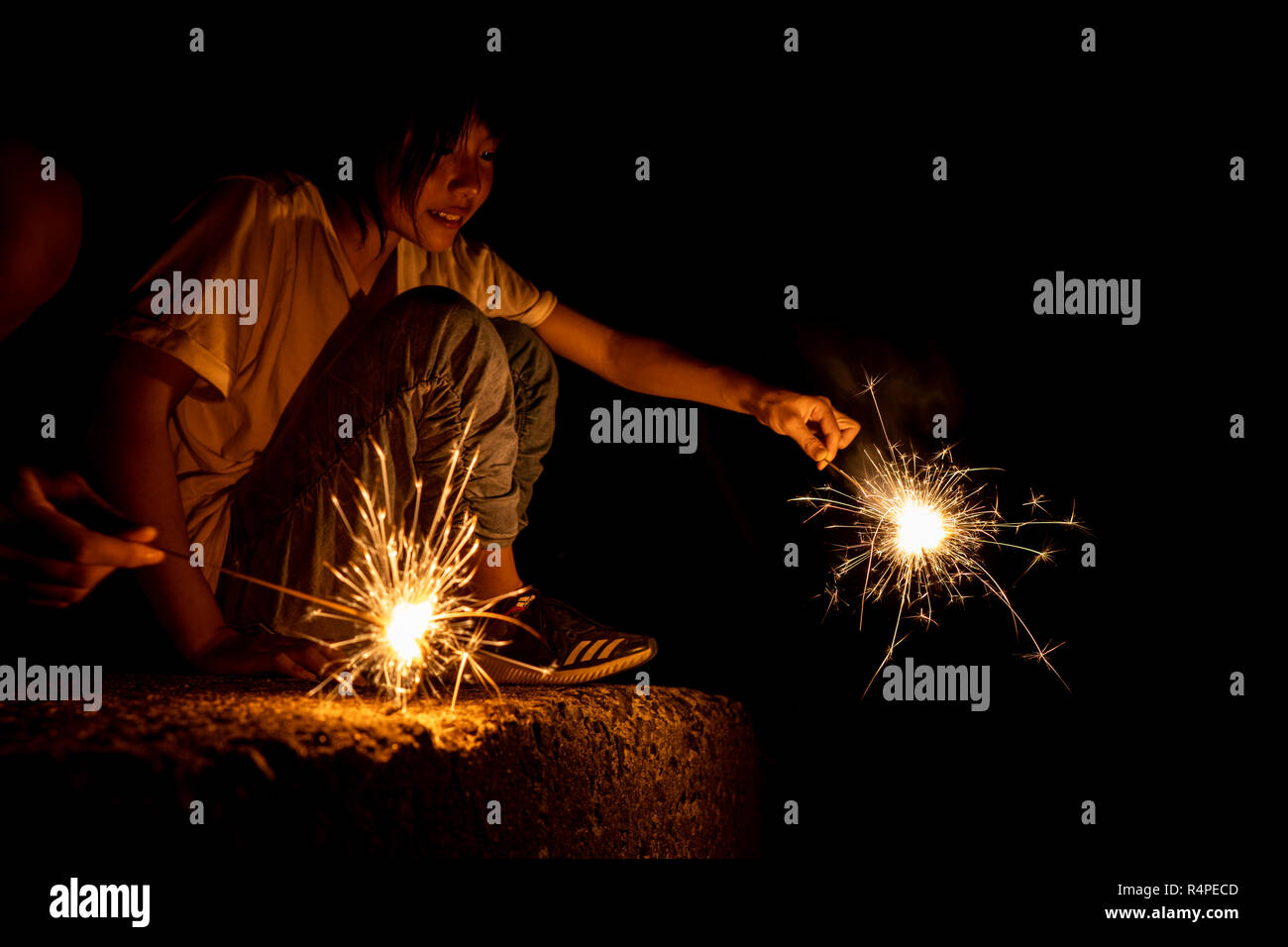 Kids Playing Fireworks Stock Photo - Alamy