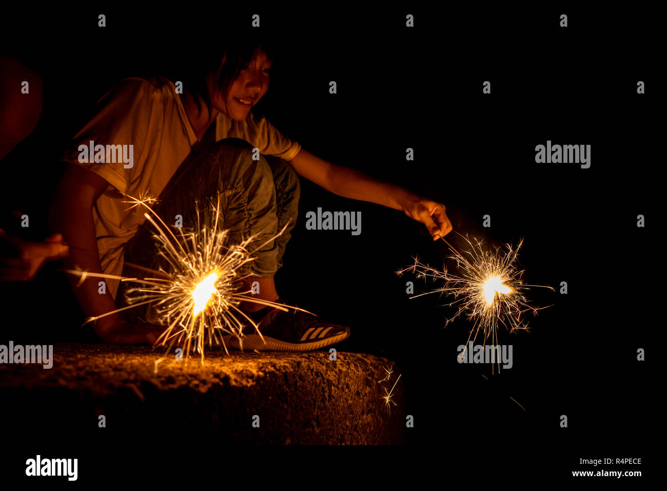 Kids Playing Fireworks Stock Photo - Alamy