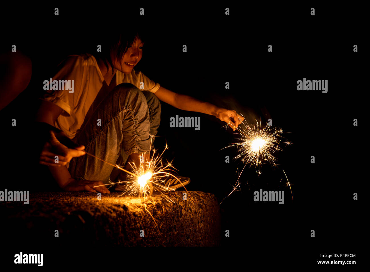 Kids Playing Fireworks Stock Photo - Alamy