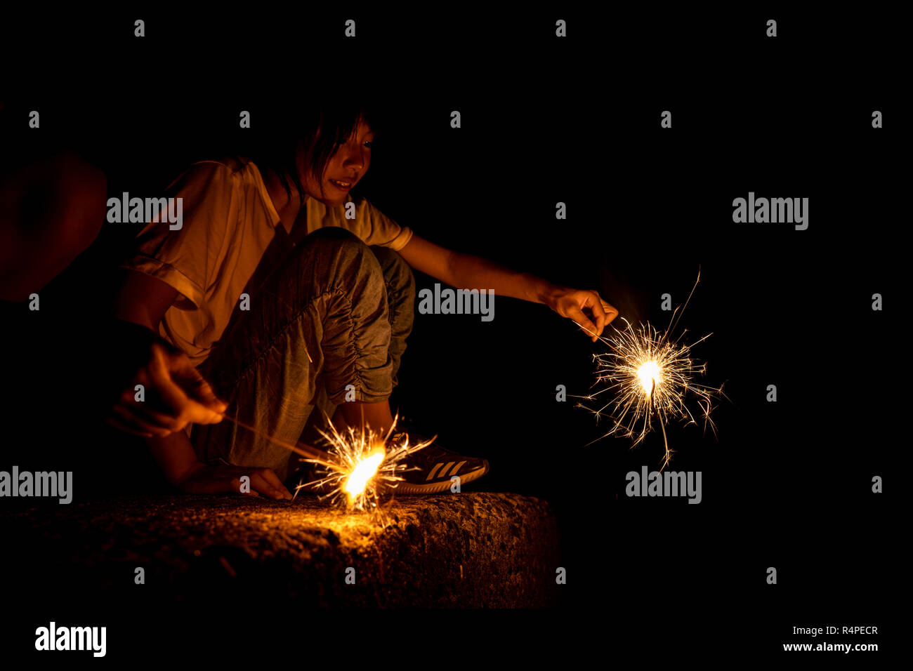 Kids Playing Fireworks Stock Photo - Alamy