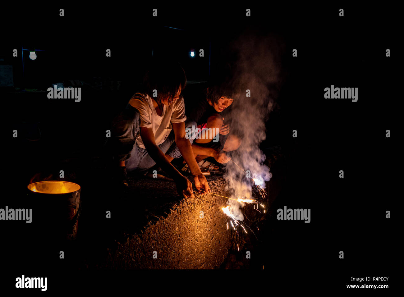 Kids Playing Fireworks Stock Photo - Alamy