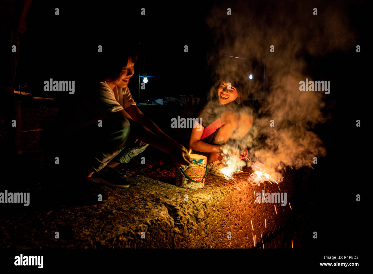 Kids Playing Fireworks Stock Photo - Alamy