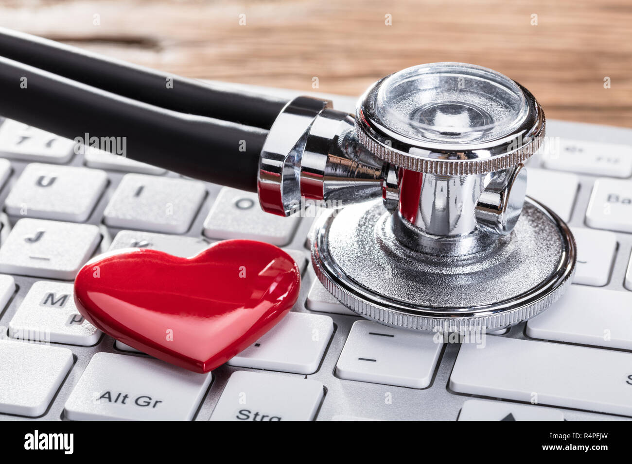 Stethoscope And Heart Shape On Keyboard Stock Photo - Alamy