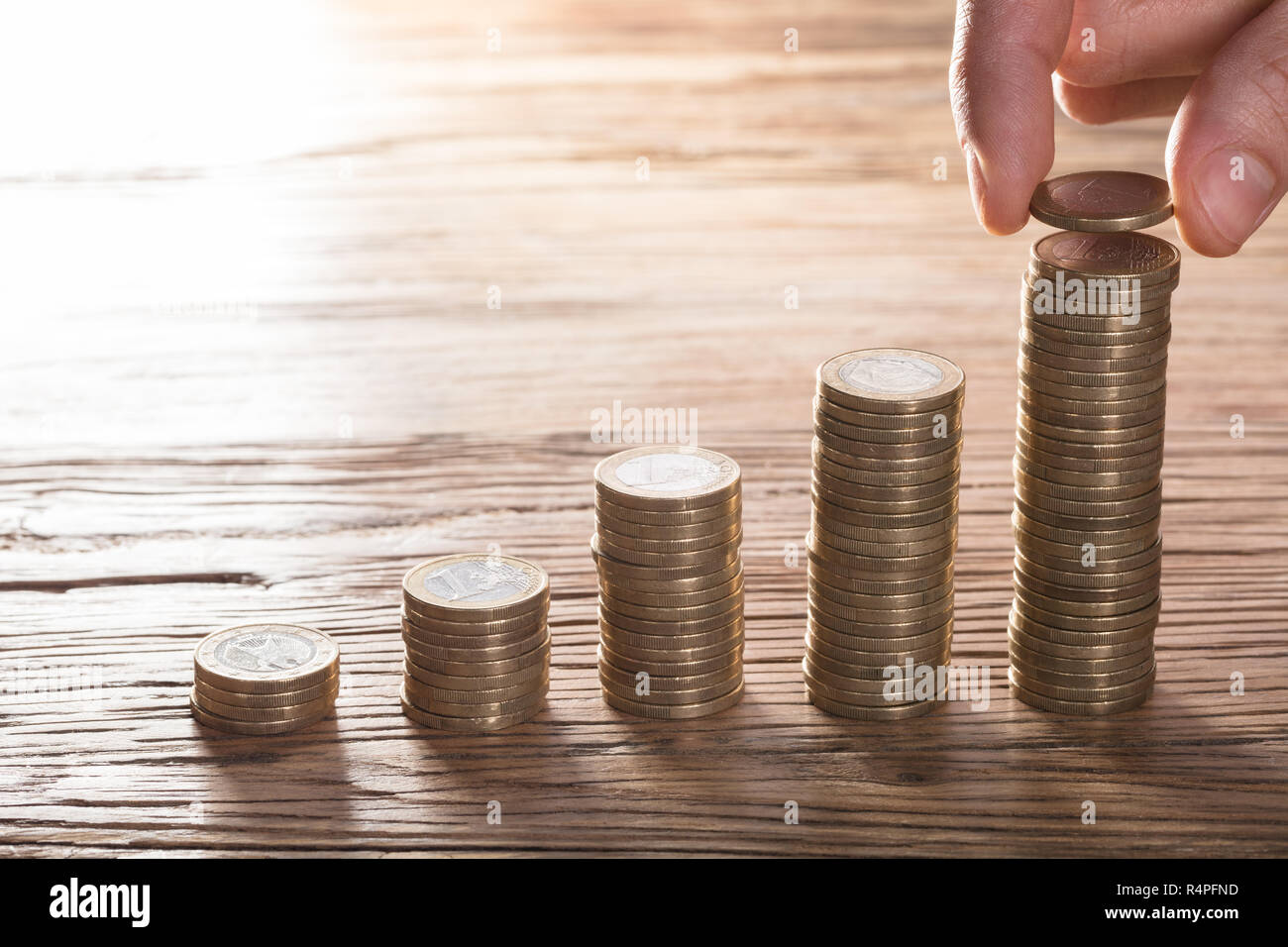 Increasing Coin Stacks Stock Photo - Alamy