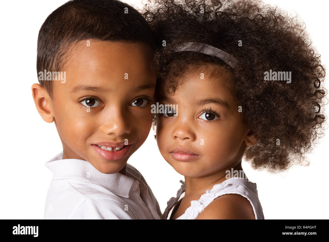 Close up portrait of two adorable siblings brother and sister hugging ...