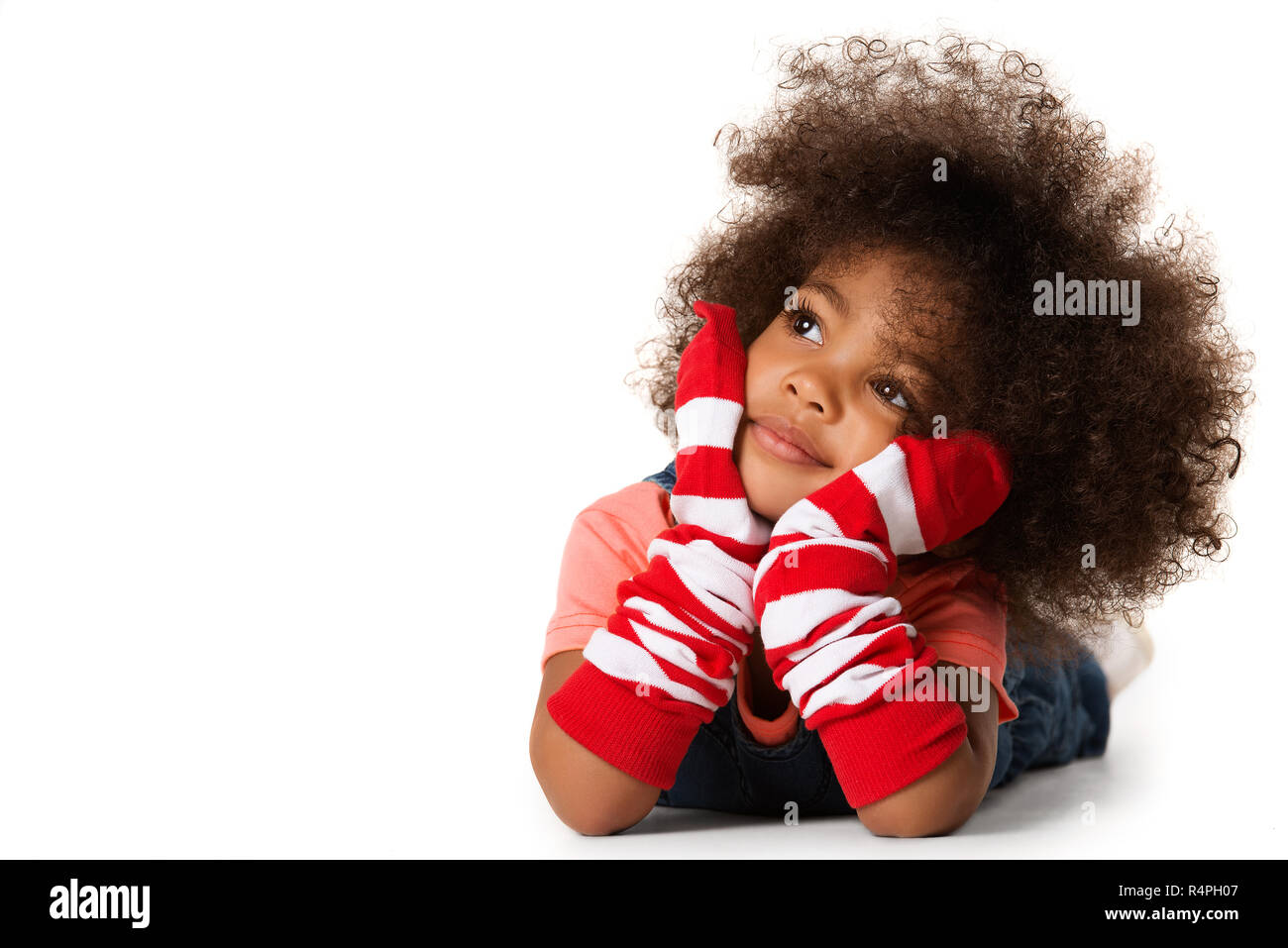 Portrait of a preschool child girl laying down. Studio shot. Isolated ...