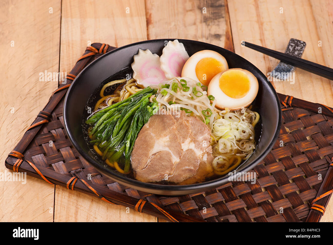 Shoyu Ramen noodle with pork rib, eggs, spinach and sprouts on bamboo ...
