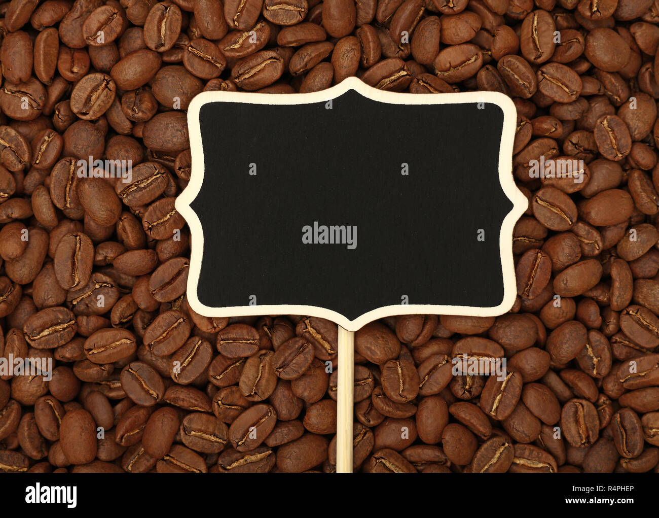 Black chalkboard sign over roasted coffee beans Stock Photo - Alamy