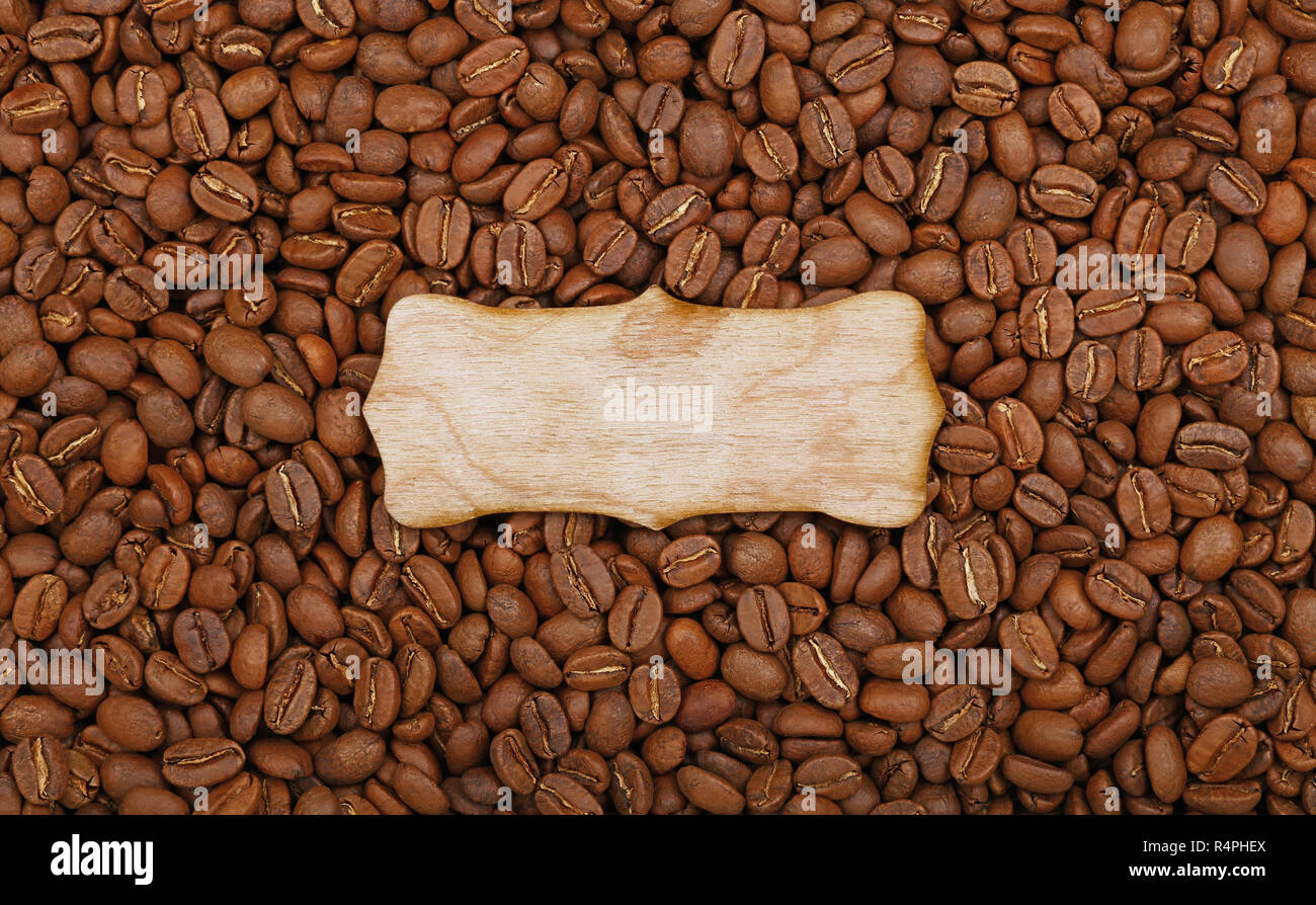 Wooden sign over roasted coffee beans Stock Photo - Alamy