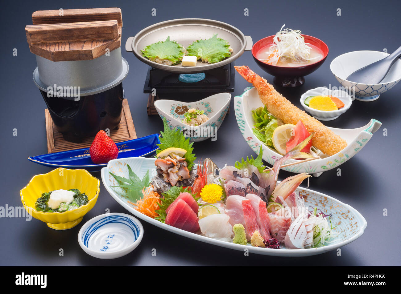 Japanese special meal with sushi tuna, shrimp, shell, fried fish, and ...