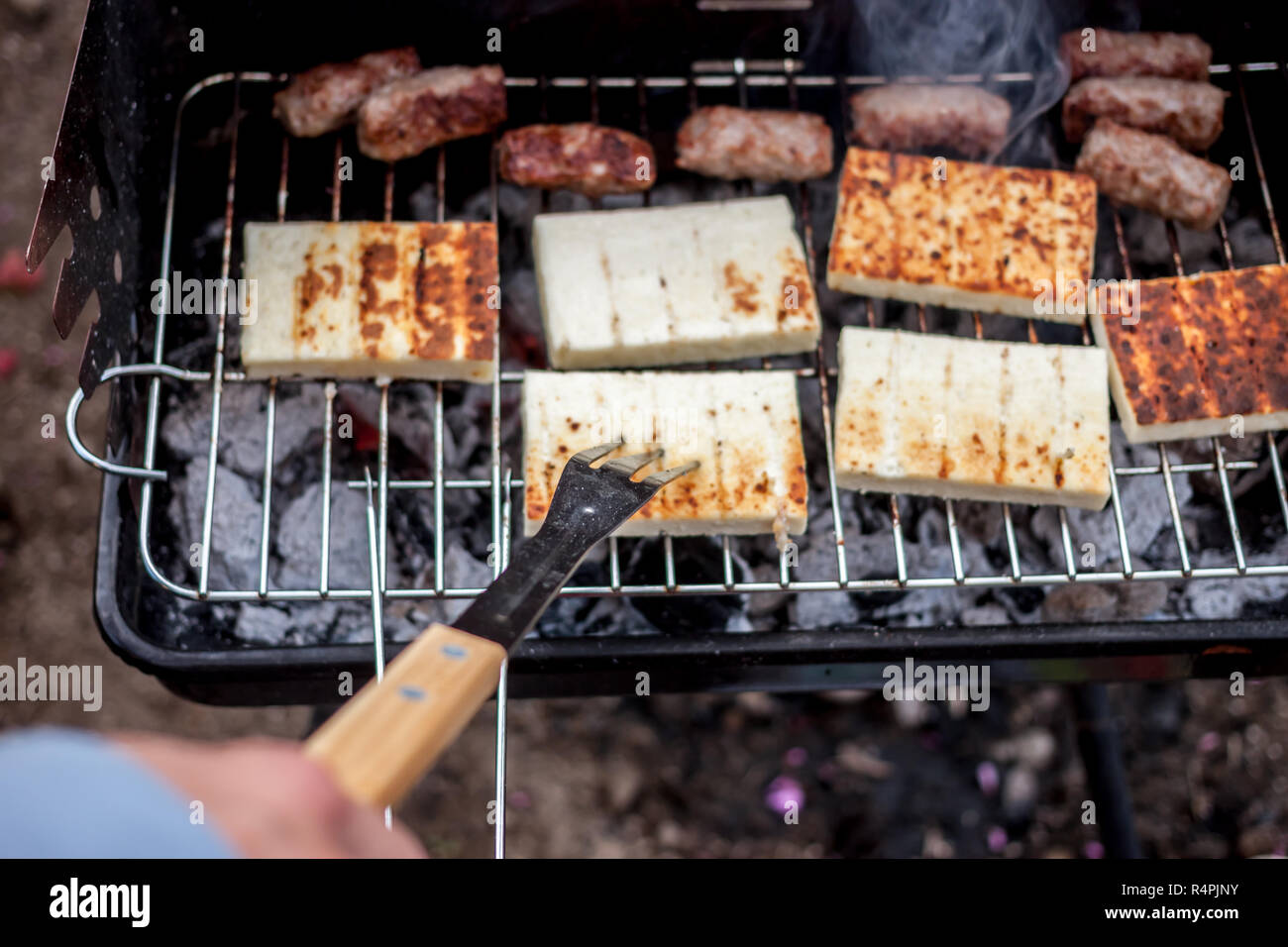 grilled cevapcici and cheese balkan cuisine Stock Photo - Alamy