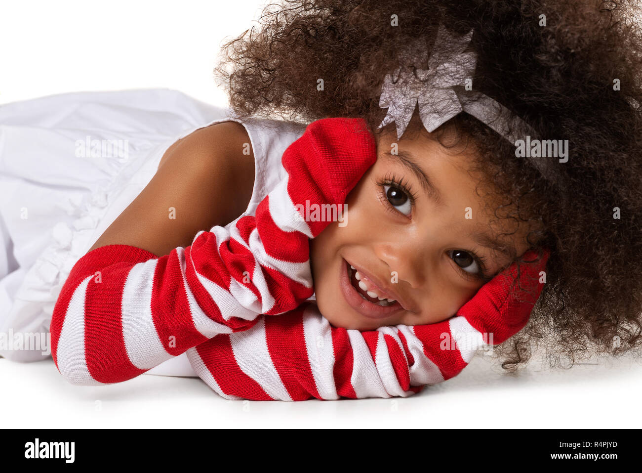 Portrait of a preschool child girl laying down. Studio shot. Isolated ...