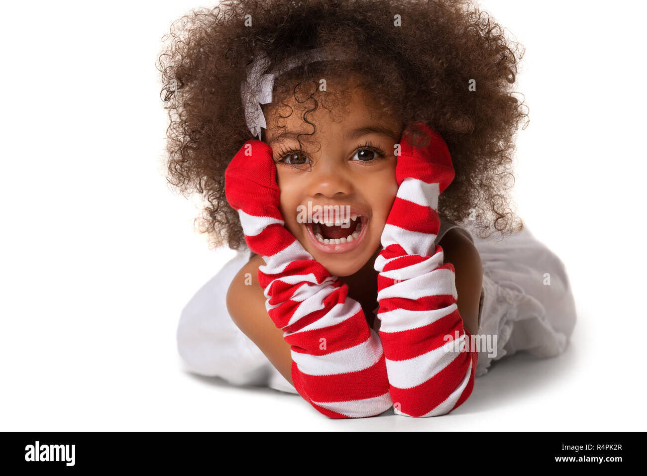 Portrait of a preschool child girl laying down. Studio shot. Isolated ...