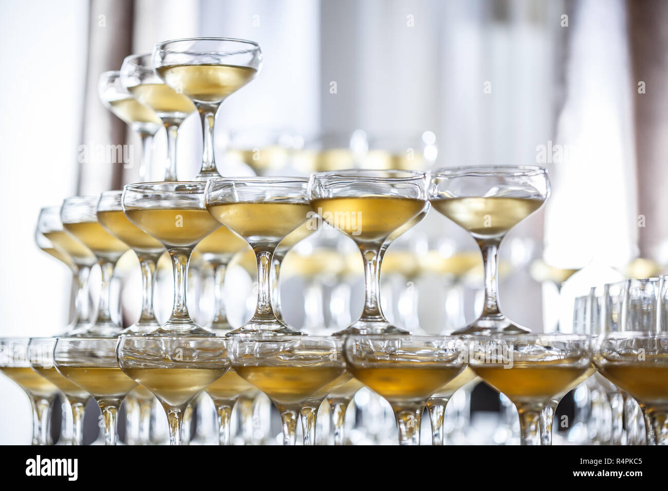 Champagne glasses standing in a tower Stock Photo - Alamy