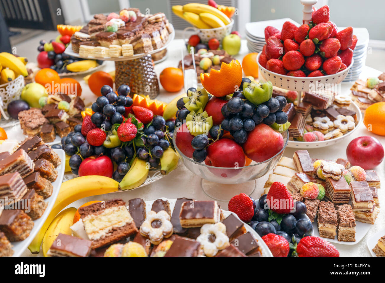 Wedding table full of fruits and sweets Stock Photo - Alamy