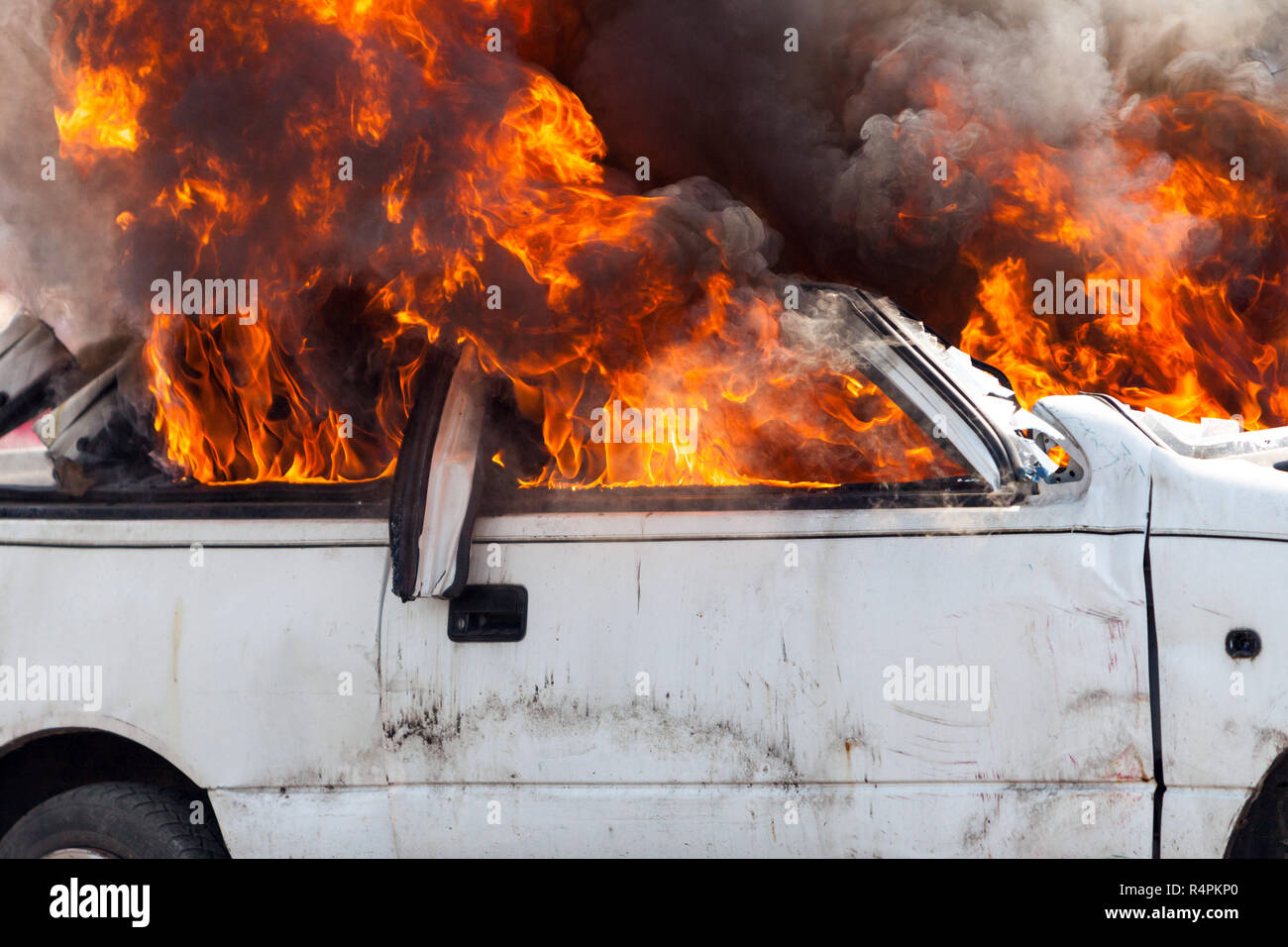 burning car burning car - Exercise firefighters Stock Photo - Alamy