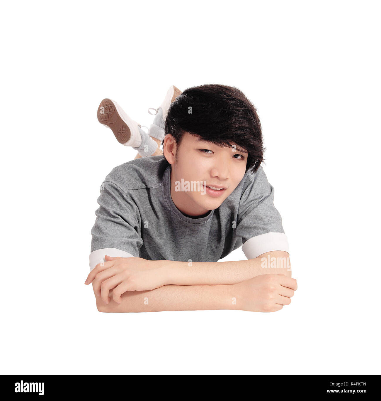 Young Asian man lying on floor Stock Photo - Alamy