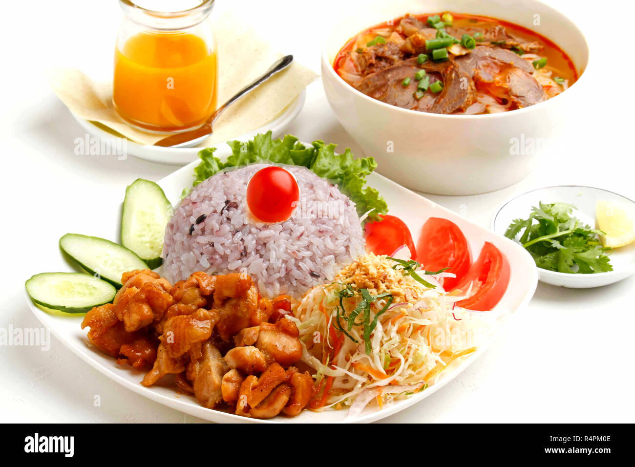 Vietnamese lunch set of rice with fried meat and salad Stock Photo - Alamy