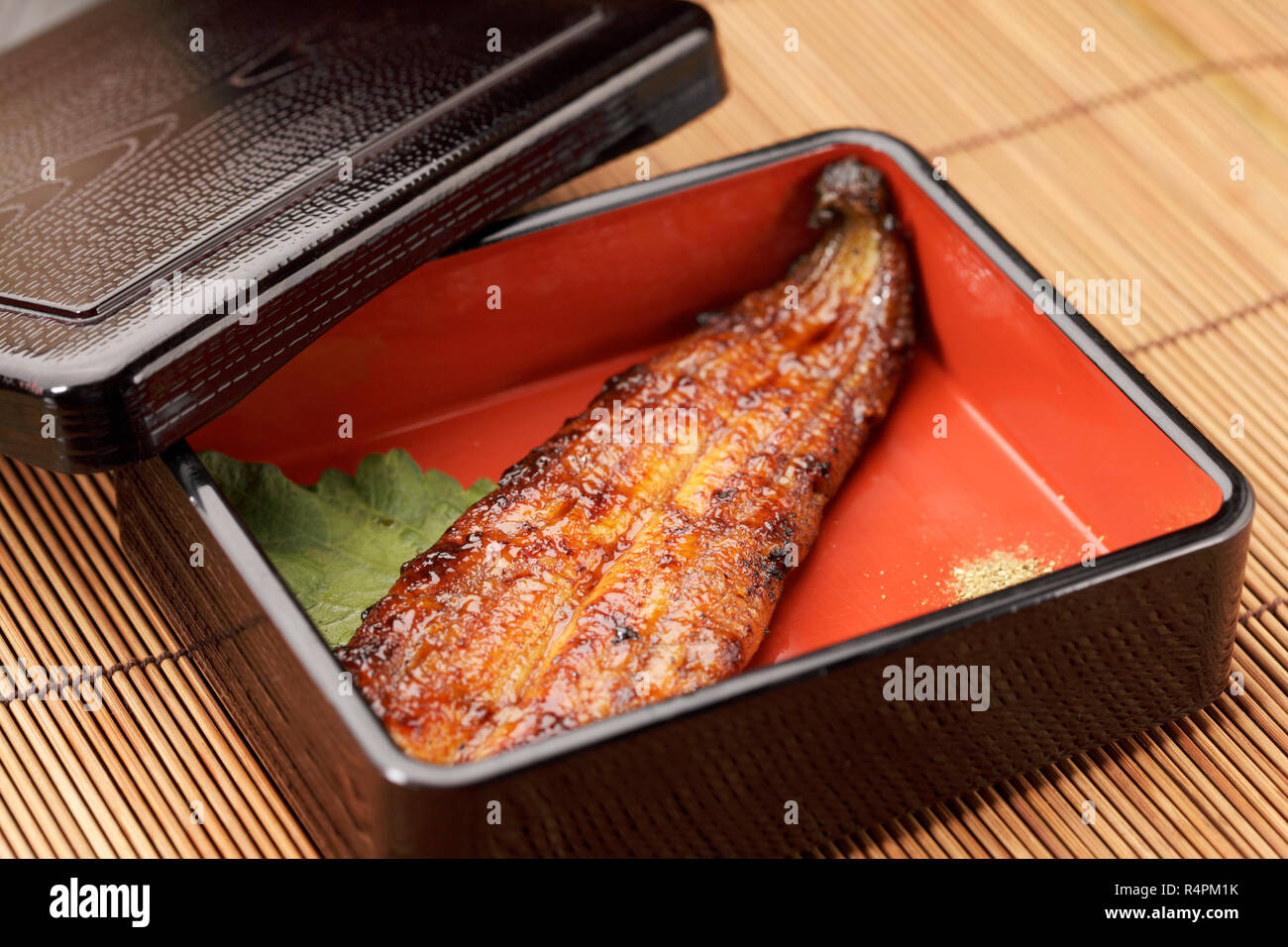 Roasted of fillet fish in bento Stock Photo - Alamy