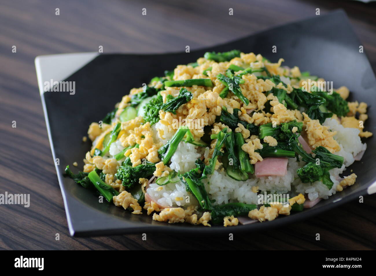 Platter of rice with egg and vegetables Stock Photo - Alamy