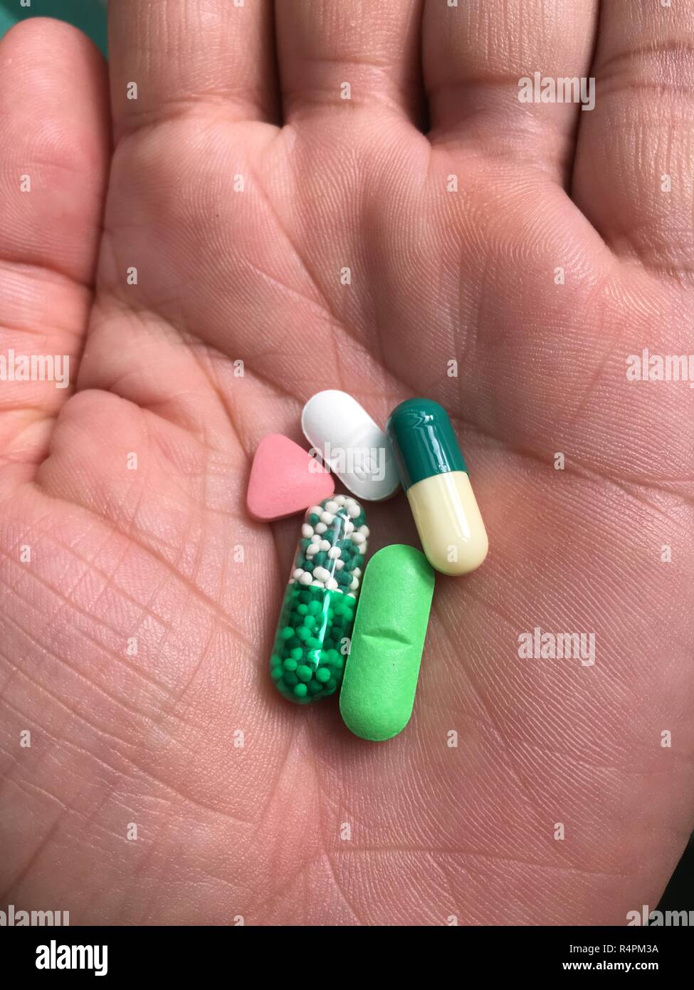Medicine drug in hand Stock Photo - Alamy