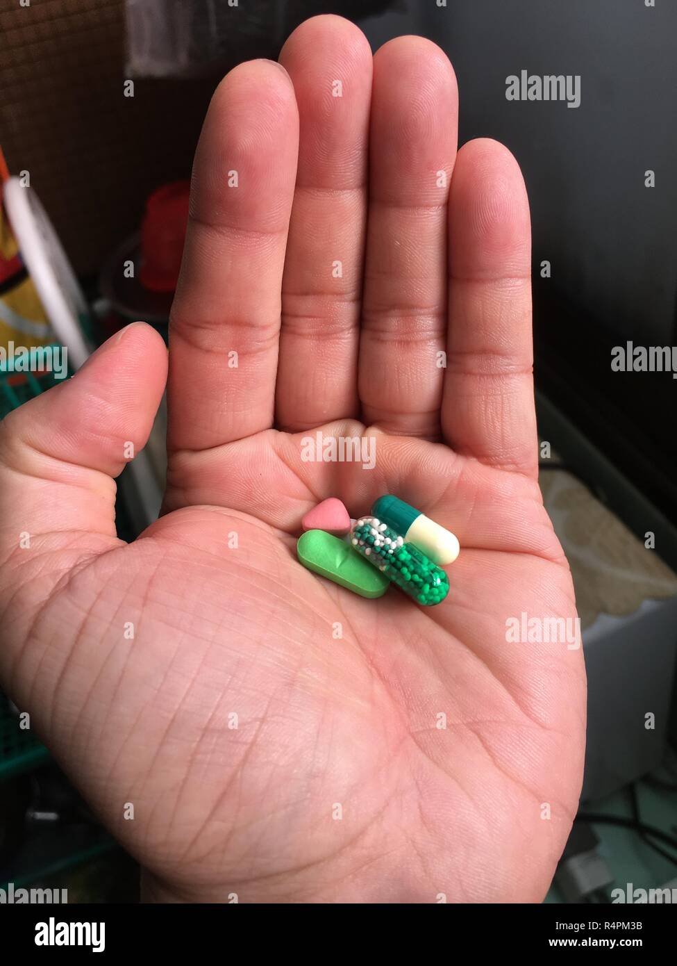 Medicine drug in hand Stock Photo - Alamy