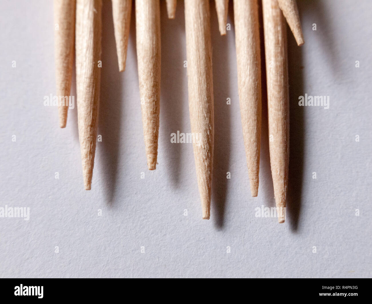 a line of the ends of cocktail sticks on white background Stock Photo ...