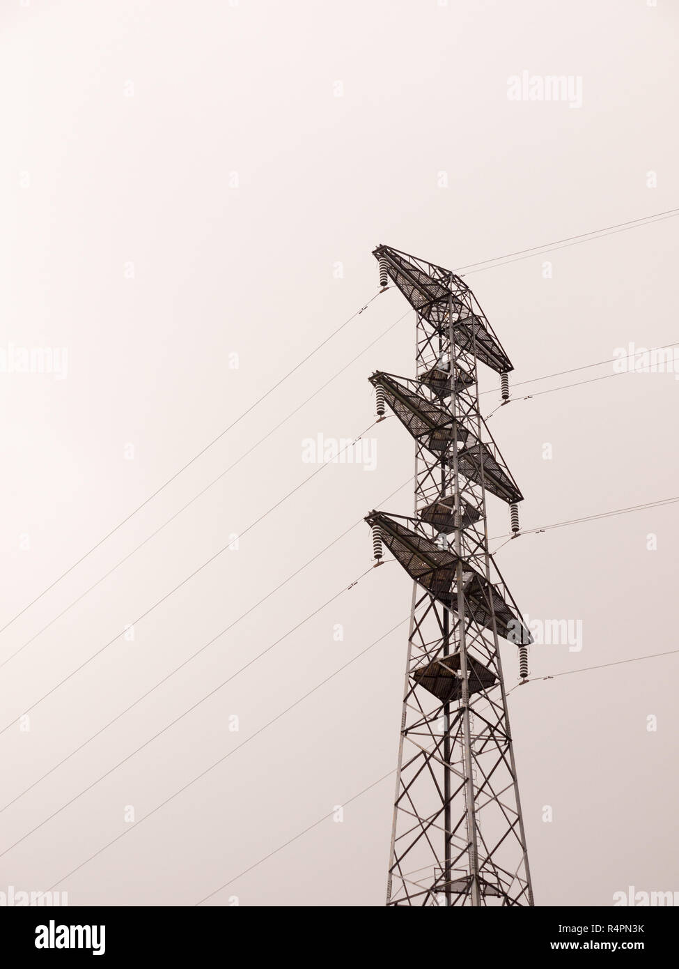 top part of electrical pylon cables of network Stock Photo - Alamy