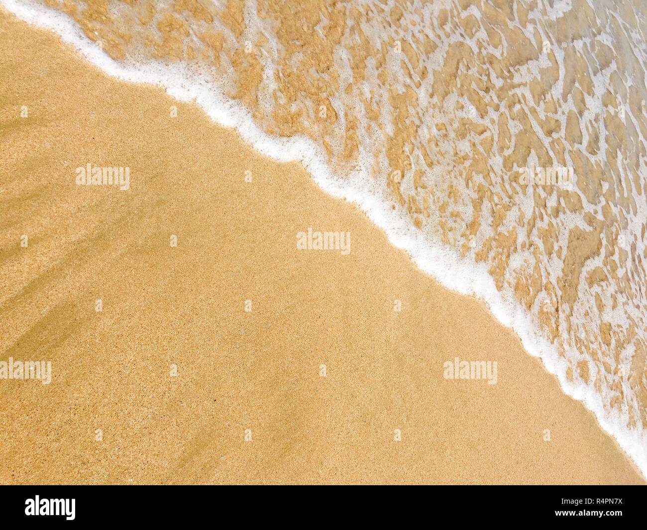 Sea waves reaching lapping to shore Stock Photo - Alamy