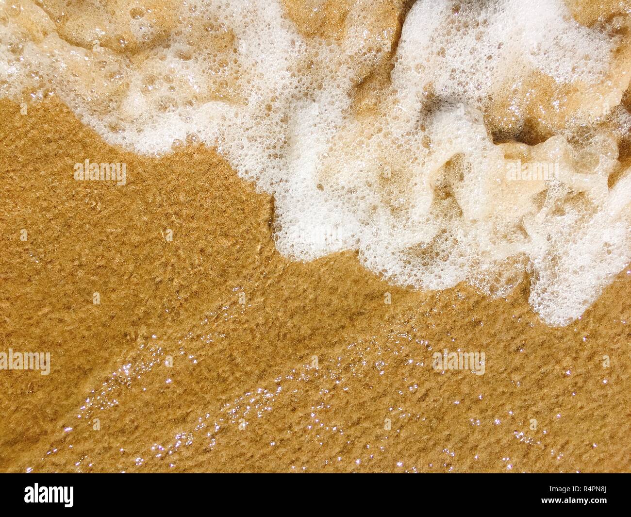 Sea waves reaching lapping to shore Stock Photo - Alamy