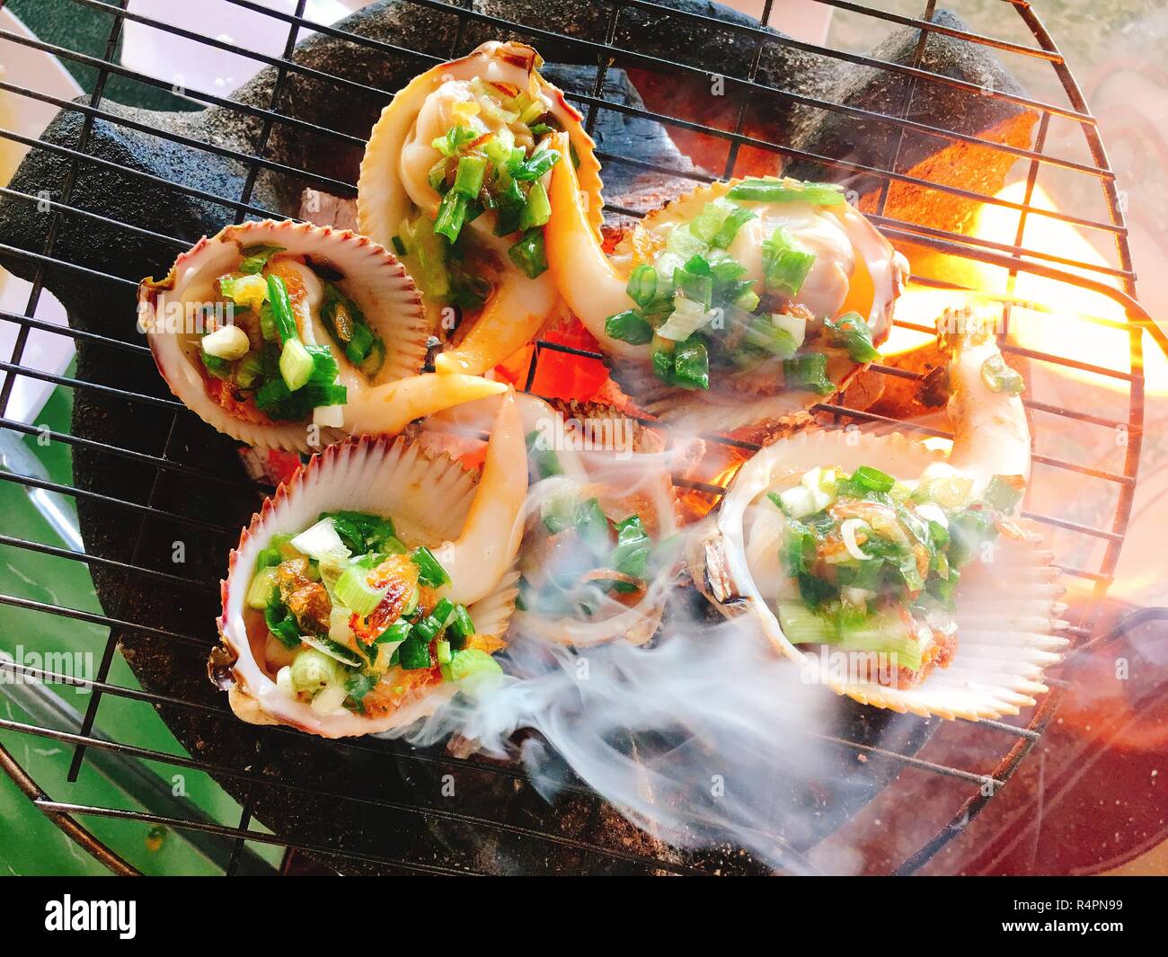 Delicious shell or clams mussels on hot fire coal grill Stock Photo - Alamy
