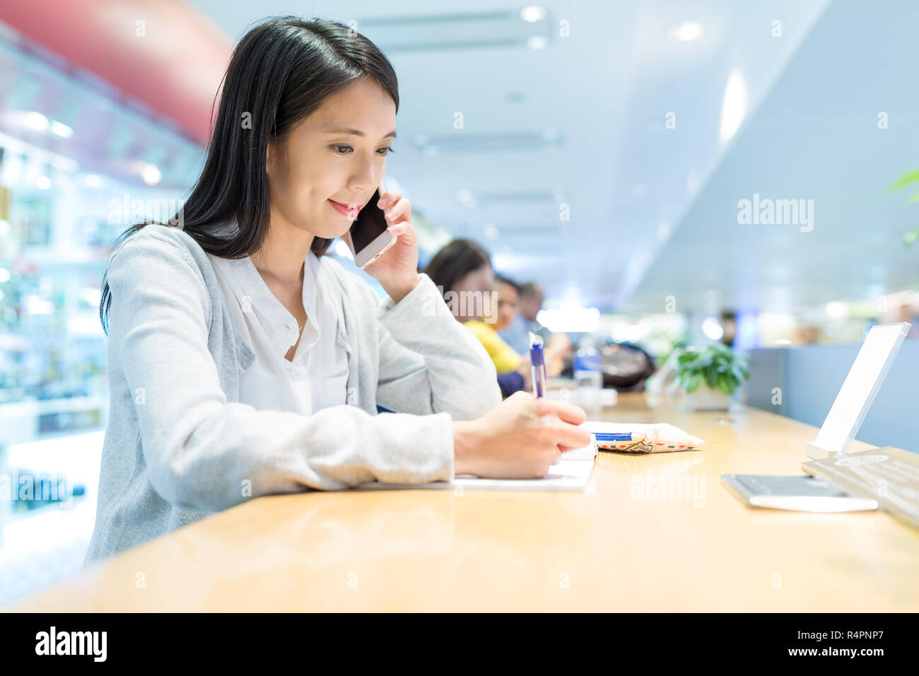 Woman taking book counter hi-res stock photography and images - Alamy