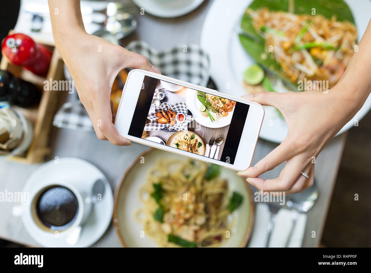 Woman taking photo dish italian food hi-res stock photography and ...