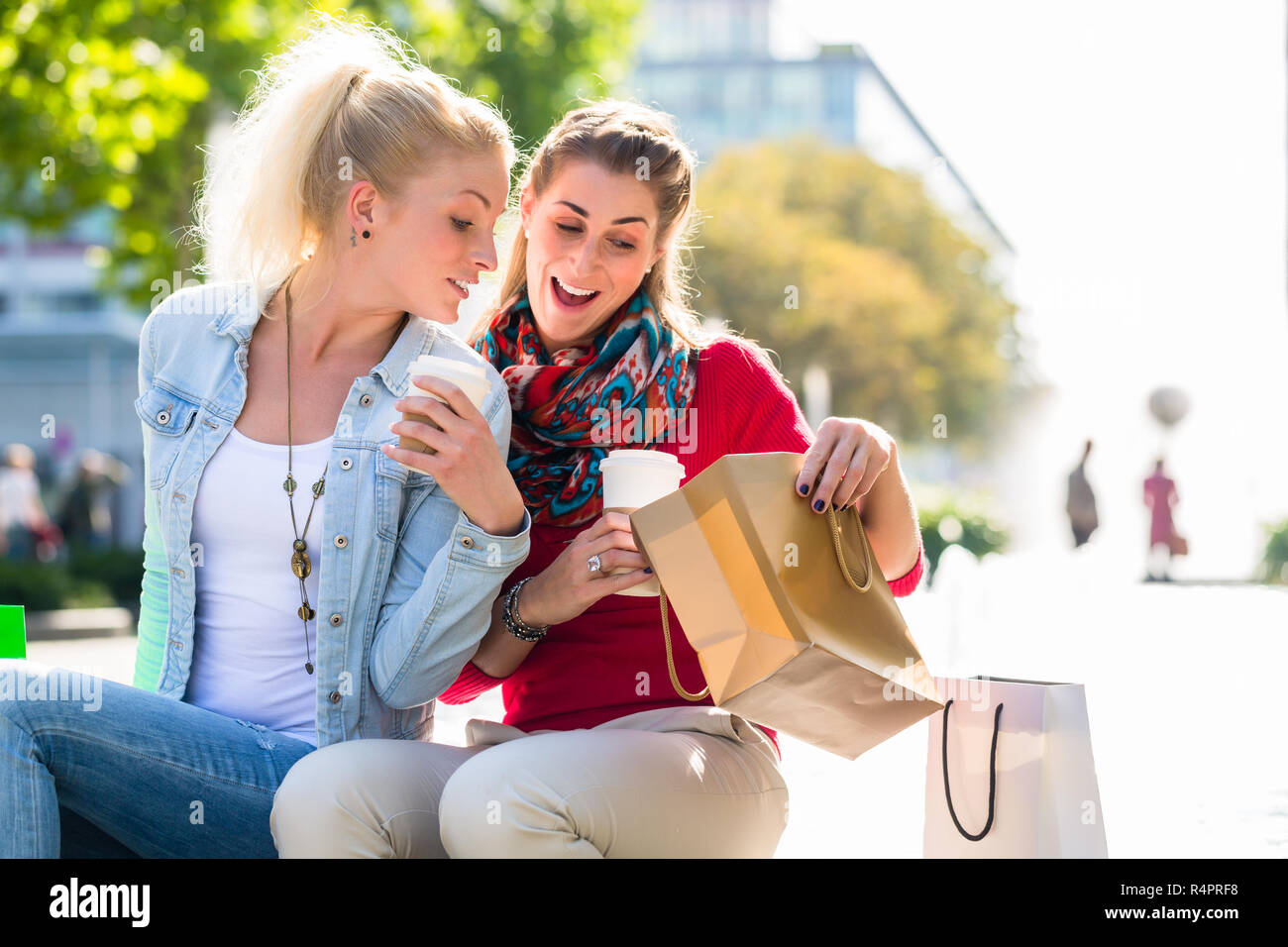 Women shopping with bags in city Stock Photo - Alamy