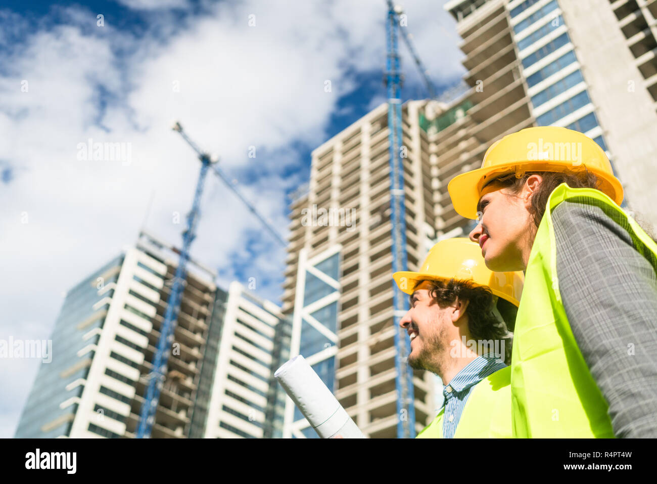 Architects supervising progress of high rise project Stock Photo - Alamy