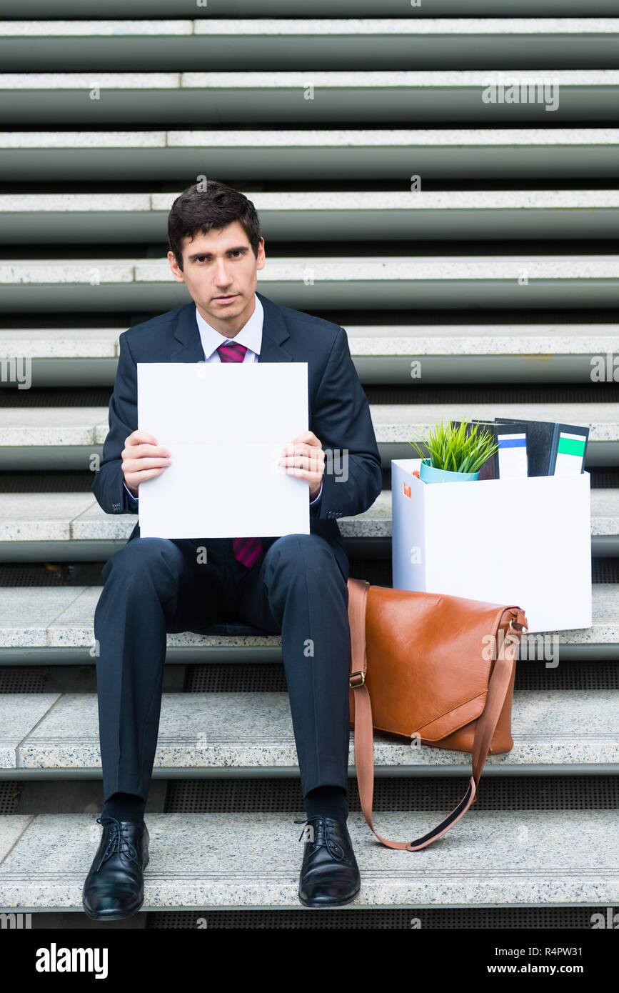 Business man down and out begging hi-res stock photography and images ...