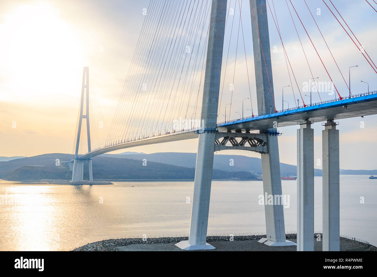 Suspended cable Russian bridge from the mainland of the Far-Eastern ...