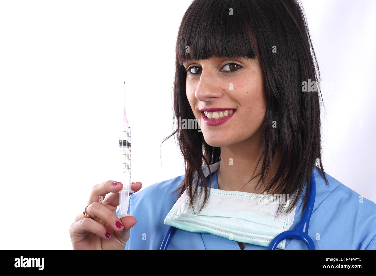 young smiling female doctor with syringe on white Stock Photo - Alamy